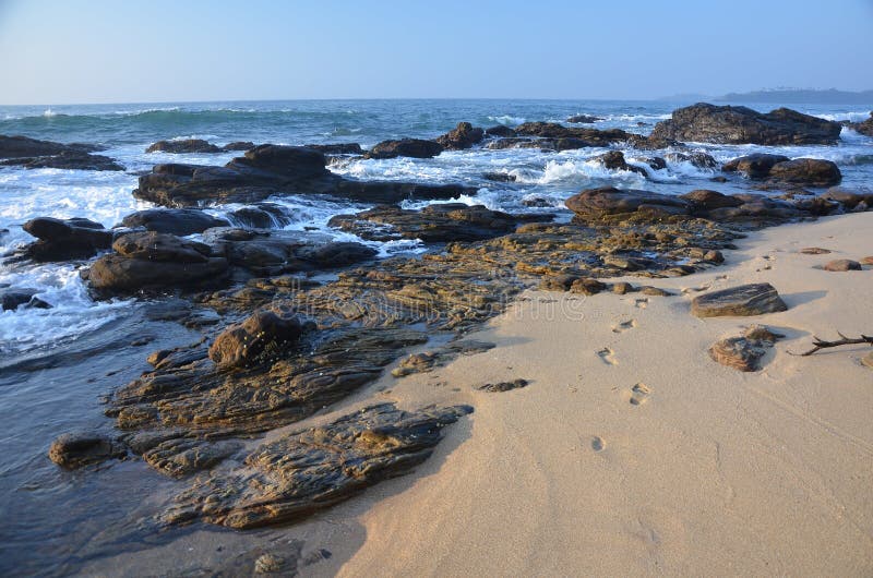 Beautiful Scenery of Rock Formations on the Beach with Splashing Sea ...