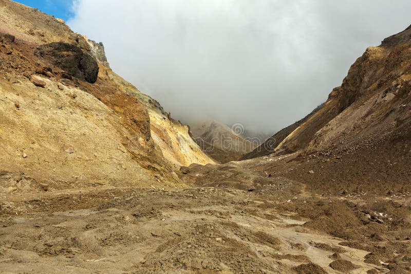 Beautiful Scenery Slopes of Volcano Mutnovsky with Clouds. Stock Image ...