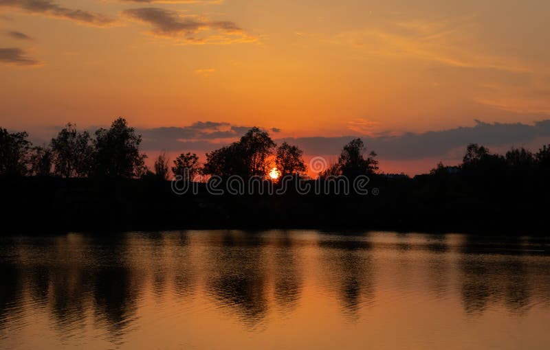 Beautiful Scenery of the Sunset Reflecting in the Lake Stock Image ...