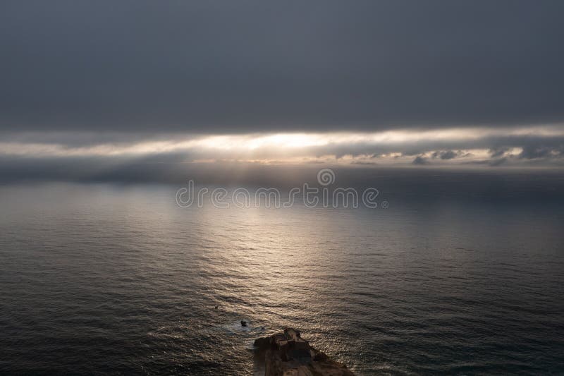 Beautiful Scenery of a Wide Ocean with Sunbeams Shining through Clouds ...