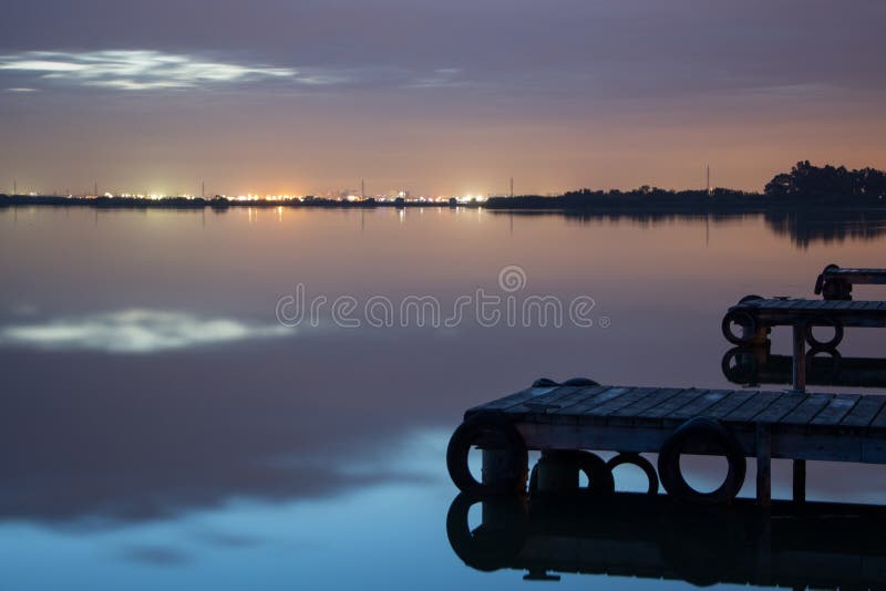 Beautiful Scenery of Wooden Docks by the Sea with the Reflection of ...