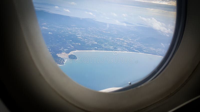 Beautiful Scenic Ocean View of Sunset through the Airplane Window Stock ...