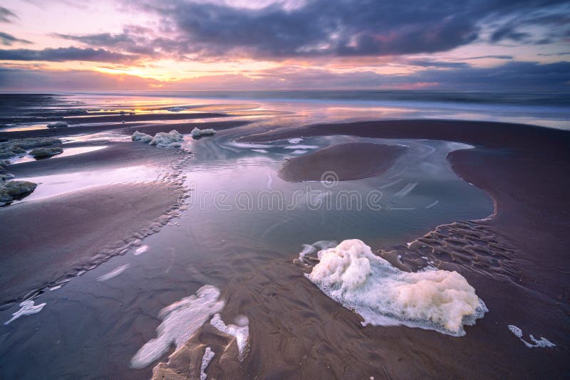 Beautiful Scenic Sunset during Low Tide at the Beach Stock Image ...