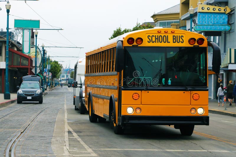 Beautiful School Bus in the Foreground on a Cloudy Day Stock Image ...