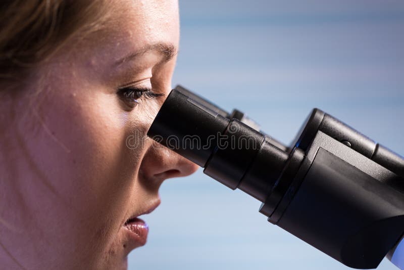 Beautiful Science Student Looking into a Microscope in a Laboratory ...