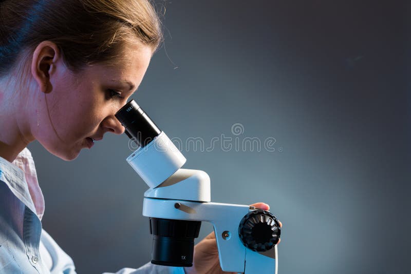 Beautiful Science Student Looking into a Microscope in a Laboratory ...