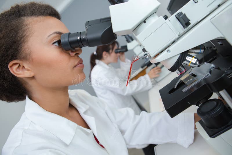 Beautiful Scientist Looking through Microscope Stock Photo - Image of ...
