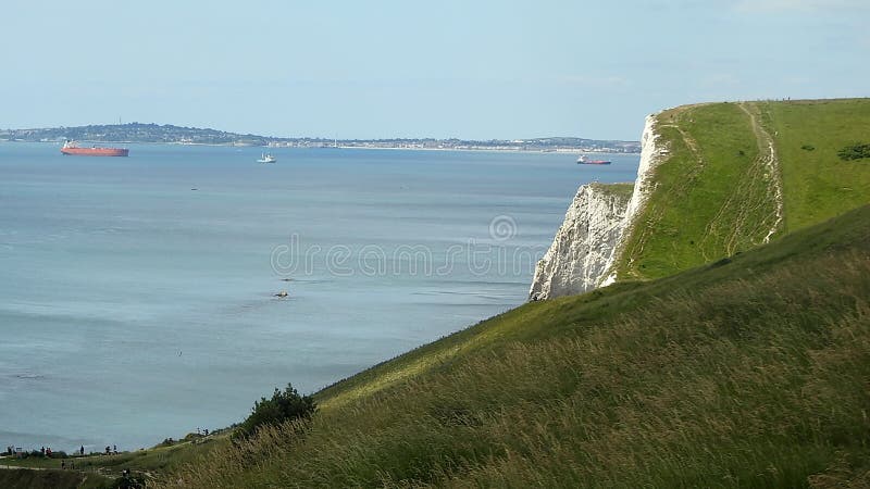 Beautiful Sea with a Green Cliff during Daytime Stock Photo - Image of ...