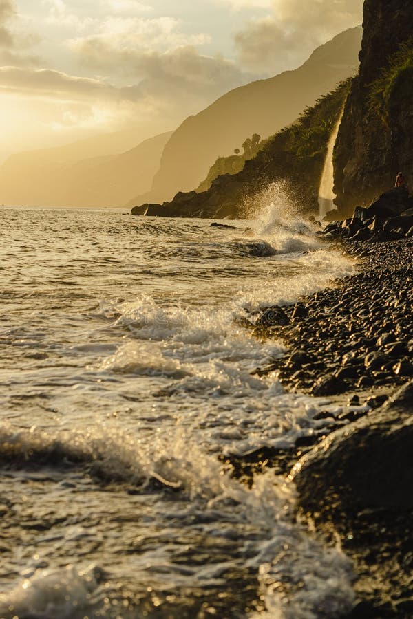 Beautiful Seascape of a Cliffside with a Powerful Waterfall Cascading ...