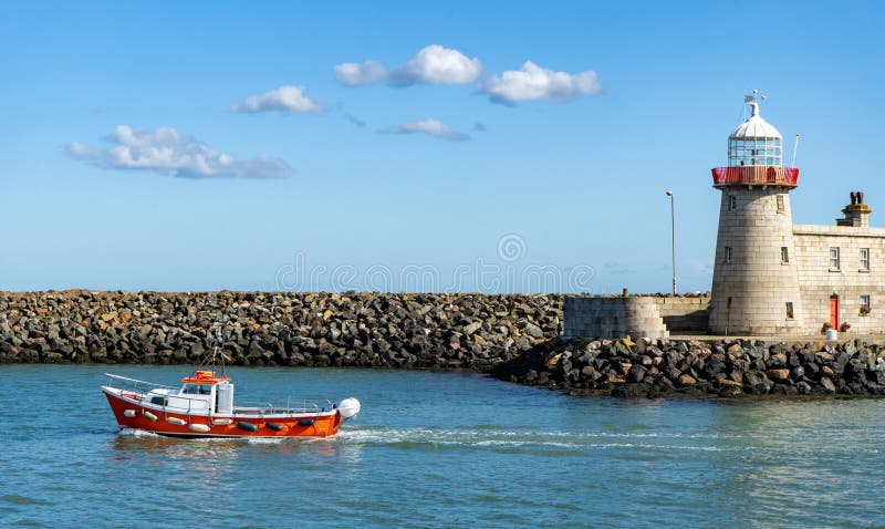 Beautiful Seascape - Howth Lighthouse with Boat Stock Photo - Image of ...