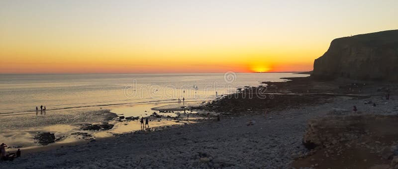 Beautiful Seascape with a Setting Sun and a Reflection in the Water ...