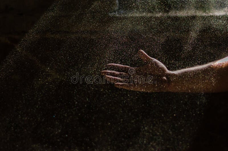 Beautiful Set of Dust Particles and a Hand Against the Background of ...