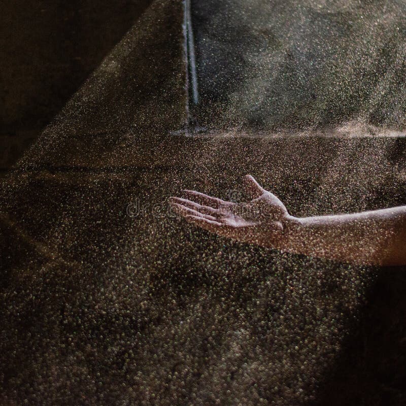 Beautiful Set of Dust Particles and a Hand Against the Background of ...