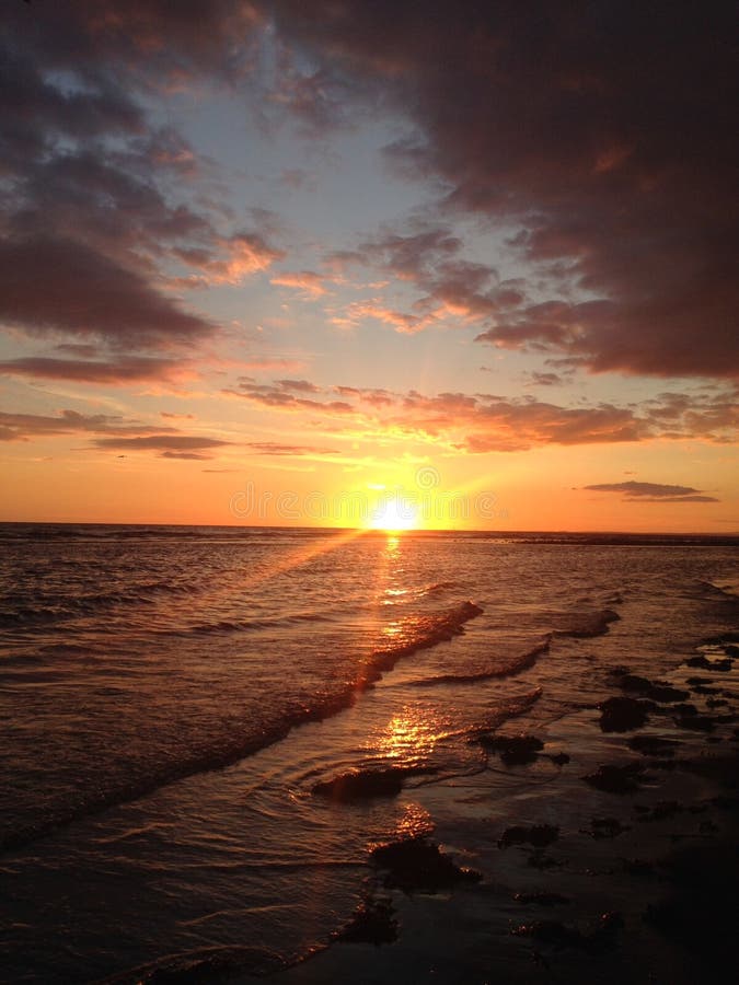 Setting Sun on Burnham Beach Sands Stock Image - Image of beach, sunset ...