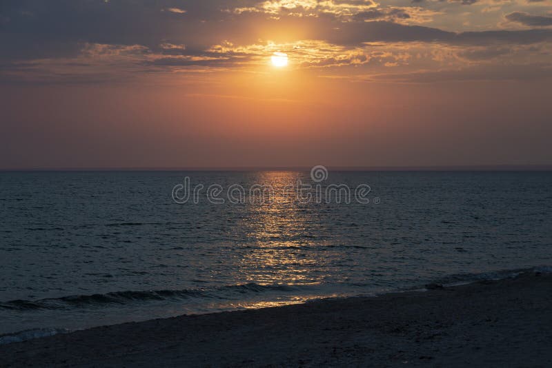 Beautiful Setting Sun with Clouds Over the Sea, Landscape Stock Photo ...