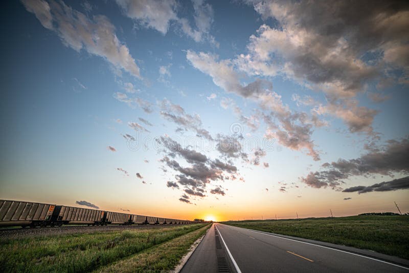 Beautiful Setting Sun at the End of a Nebraska Highway and Railroad ...