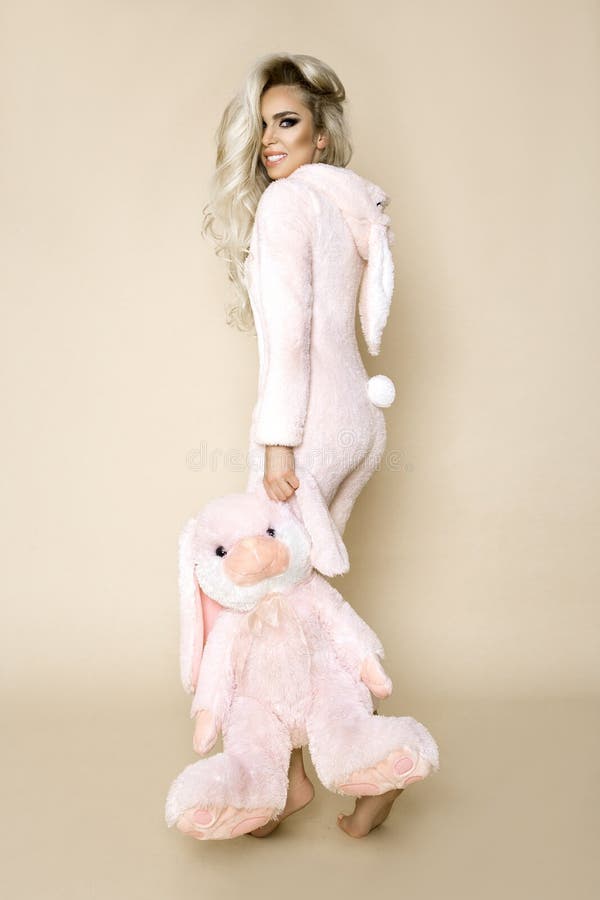 Beautiful Blonde Woman Wearing A Pajama A Bunny Costume Smiling