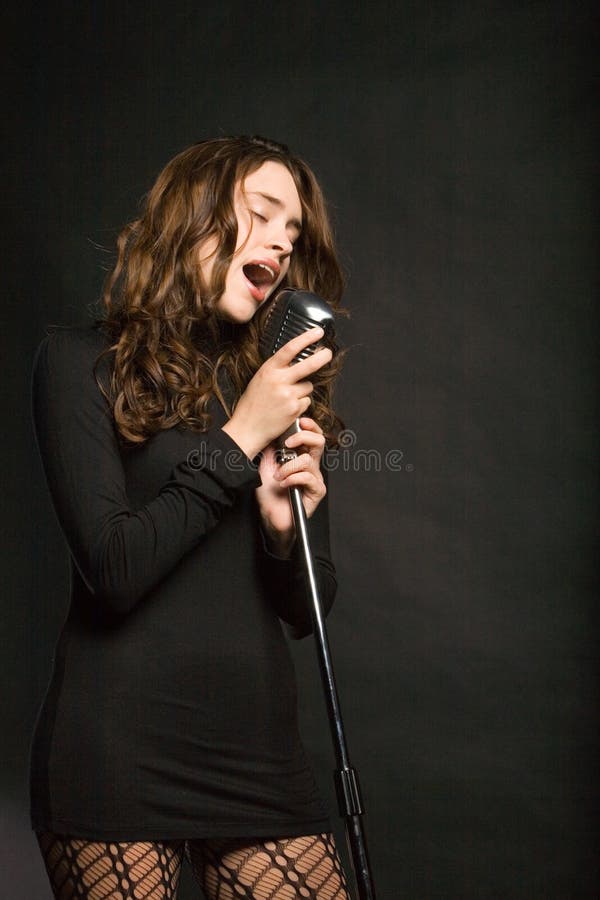 Beautiful woman singing stock photo. Image of fashionable - 6163354