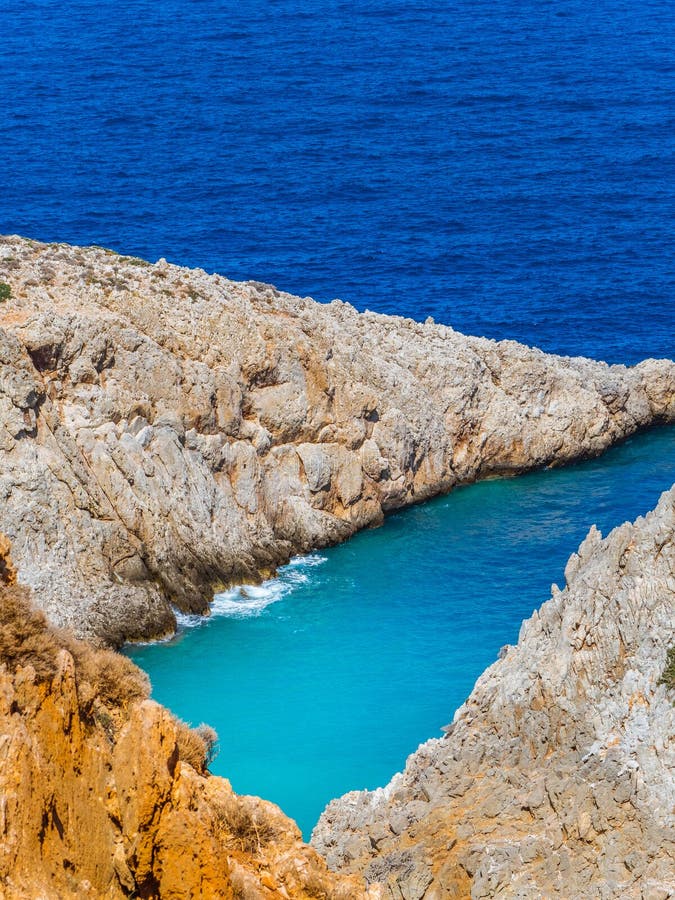 Beautiful Shades of Blue Sea and Orange Cliffs - Greece Stock Image ...
