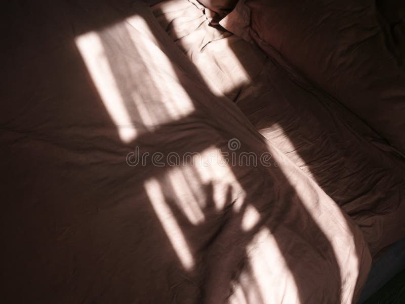 Beautiful Shadow from the Window and Hand on the Bed from the Morning ...