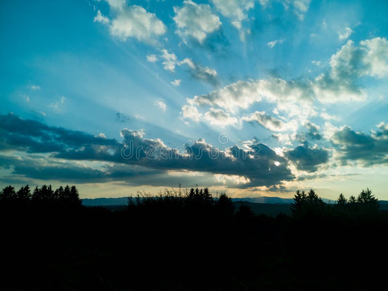 Beautiful Shining Sun Behind Big Clouds at Sunset Stock Image - Image ...