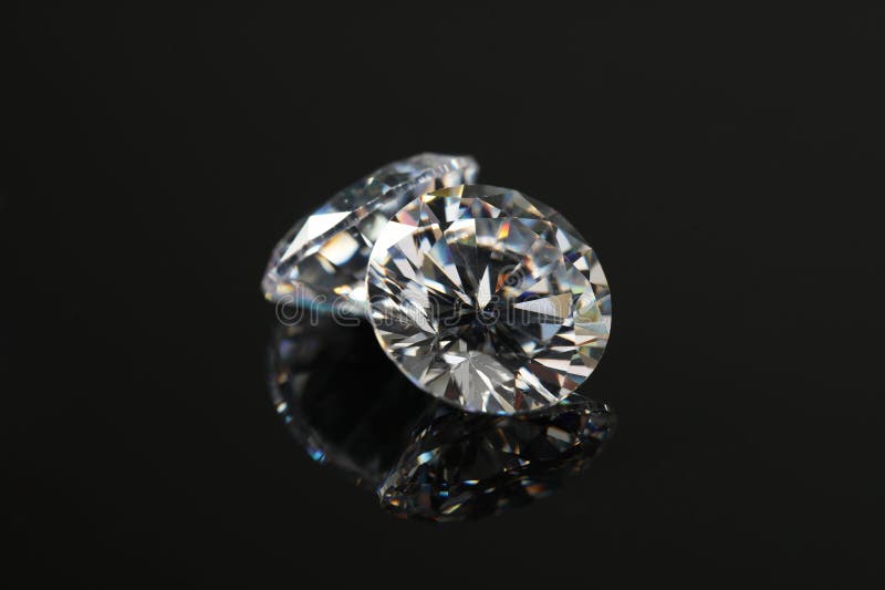 Beautiful Shiny Diamonds on Black Mirror Surface, Closeup Stock Photo ...