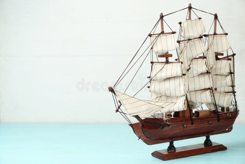 Beautiful Ship Model on Light Blue Wooden Table. Space for Text Stock ...