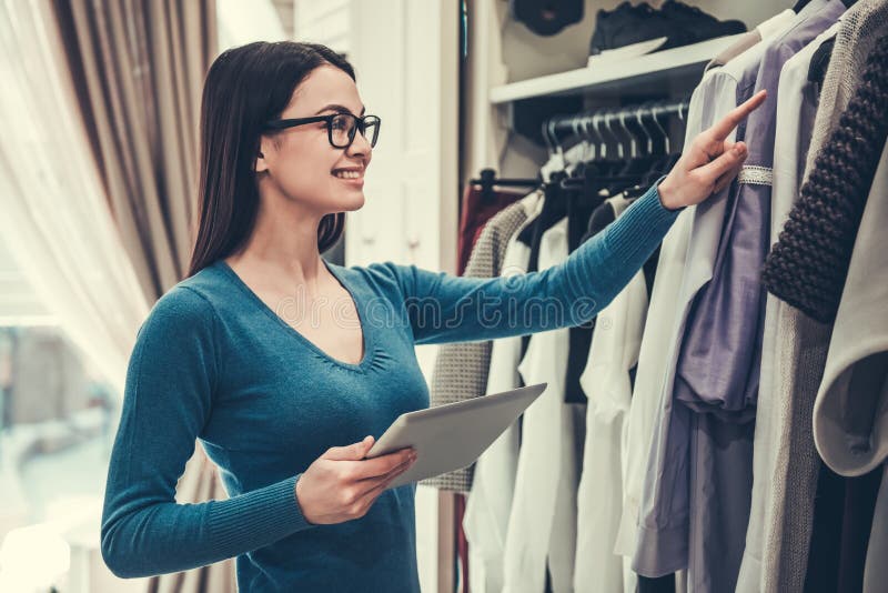 Beautiful shop assistant stock image. Image of consumerism - 97081803