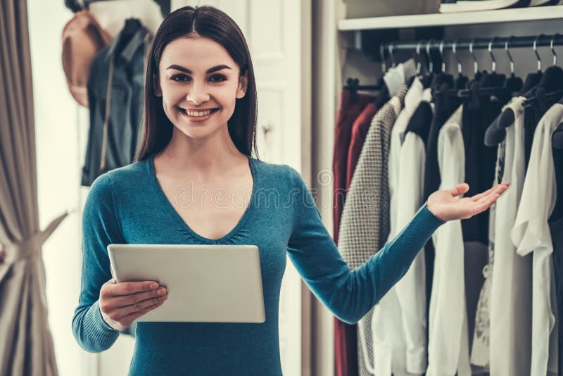 Beautiful shop assistant stock photo. Image of adult - 97081582