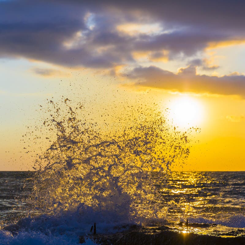 Beautiful Shoreline Scene with Waves at Sunset Beams Stock Image ...