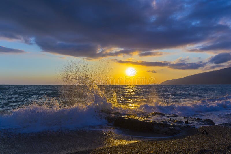 Beautiful Shoreline Scene with Waves at Sunset Beams Stock Image ...