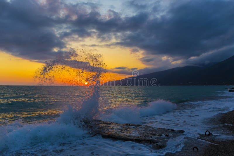 Beautiful Shoreline Scene with Waves at Sunset Beams Stock Image ...