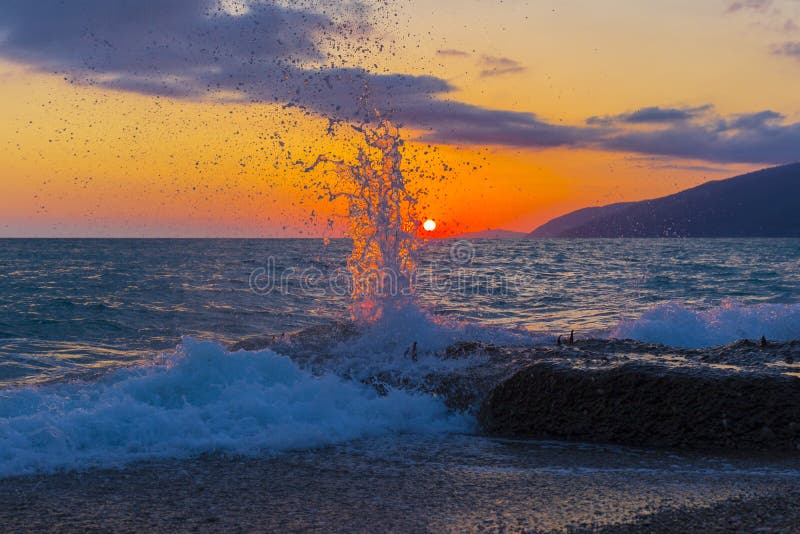 Beautiful Shoreline Scene With Waves At Sunset Beams Stock Photo ...