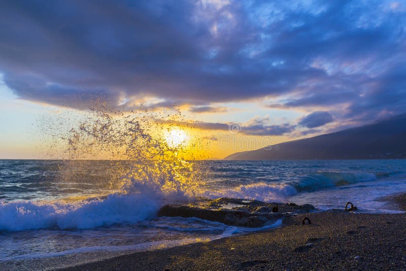 Beautiful Shoreline Scene with Waves at Sunset Beams Stock Image ...
