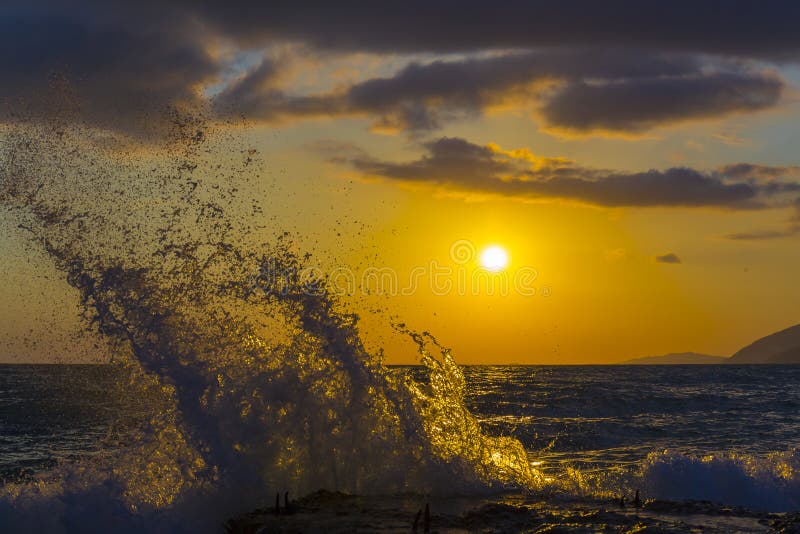 Beautiful Shoreline Scene with Waves at Sunset Beams Stock Photo ...