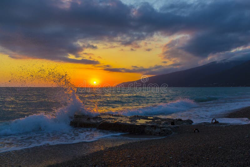 Beautiful Shoreline Scene with Waves at Sunset Beams Stock Image ...