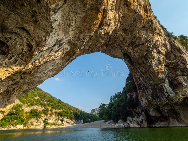 Beautiful Shot of a Big Arch-shaped Rock on a River Stock Photo - Image ...