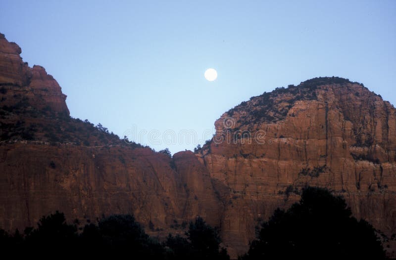 Beautiful Shot of the Cliff in a Desert with the Moon in the Sky Stock ...