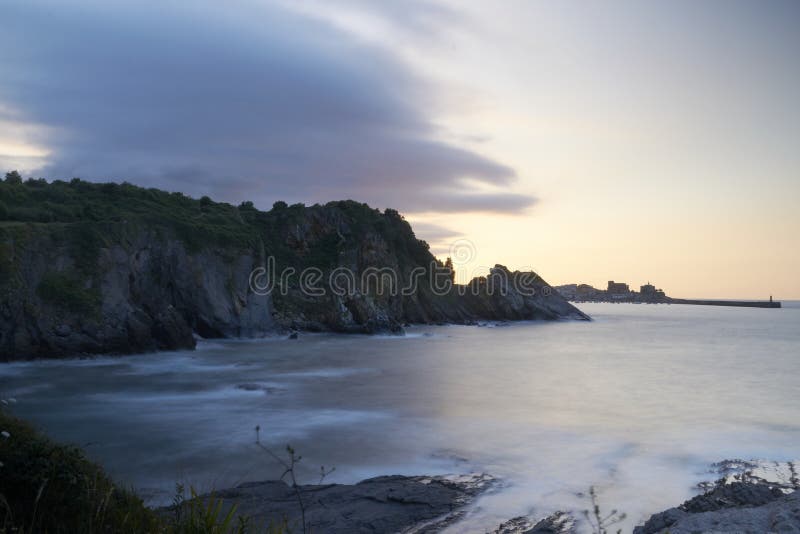 Beautiful Shot of a Cliff at a Rocky Beach at Sunset Stock Photo ...