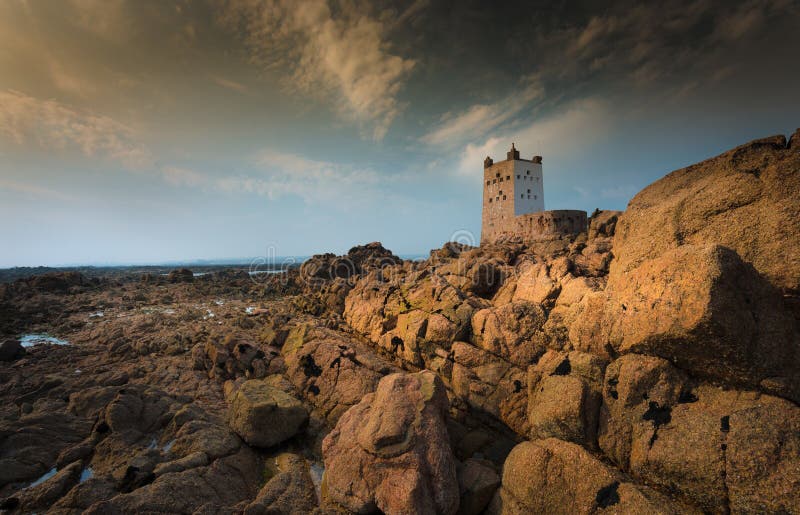 Beautiful Shot of Cliffs and Rocks with a Fort on Top Under a Blue Sky ...