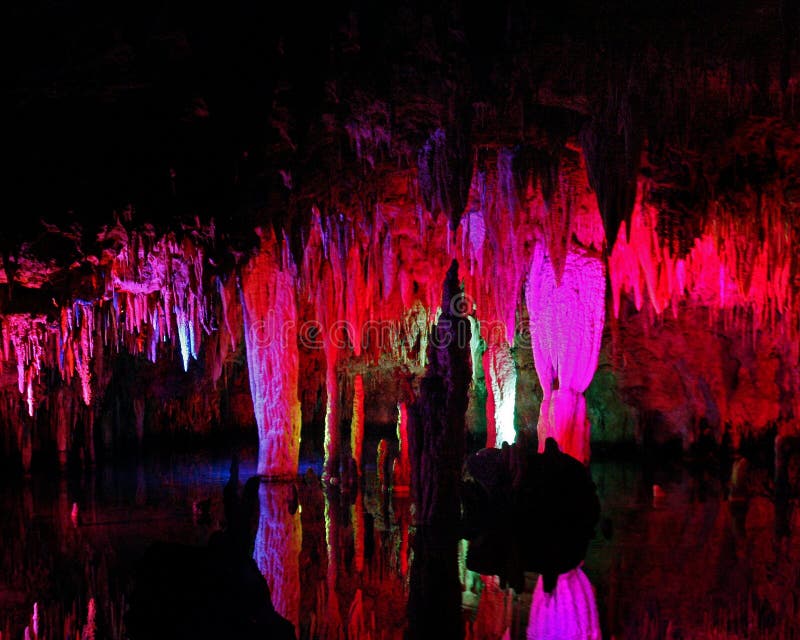 Beautiful Shot of Colored Cavern Inside a Cave Reflecting on the Water ...