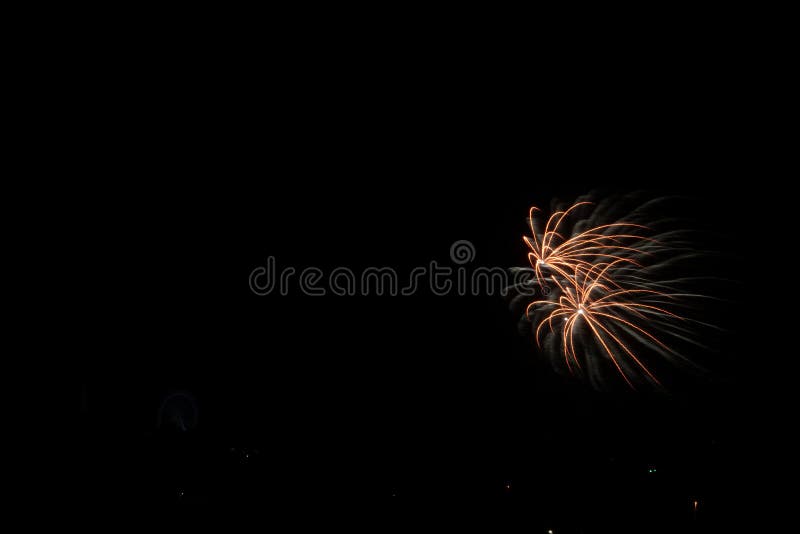 Orange Fireworks on a Dark Night Sky Perfect for Backgrounds and ...