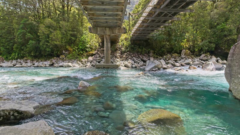 Beautiful Shot of a Lake with Rocks Under Bridges Stock Photo - Image ...
