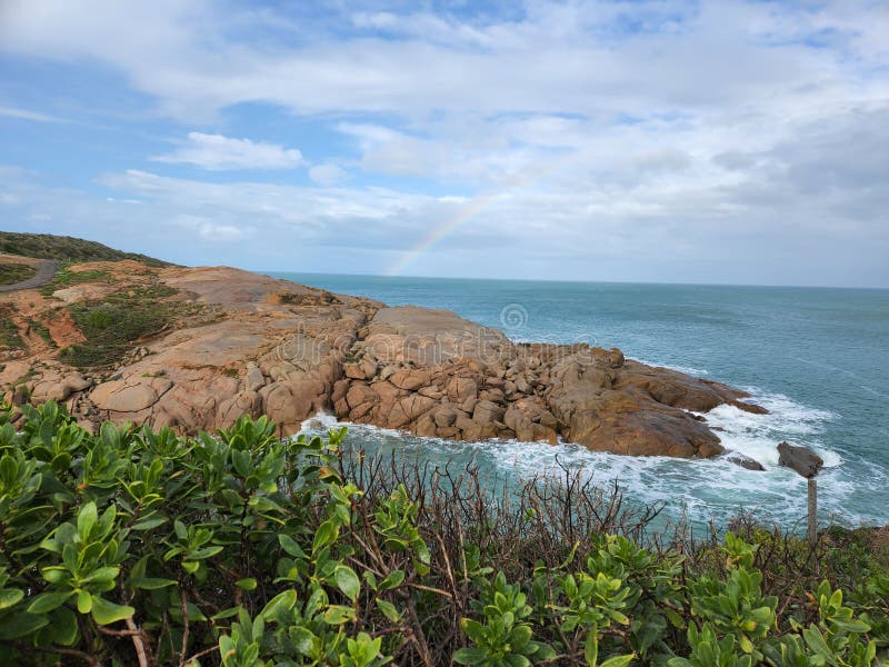 Beautiful Shot of a Ocean, Rocks and a Rainbow Stock Image - Image of ...