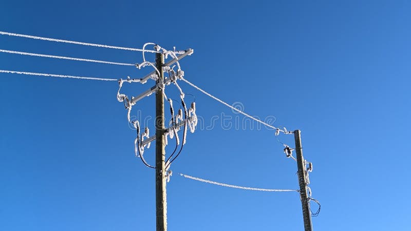 Beautiful Shot of a Power Line Post Covered with Snow Stock Photo ...