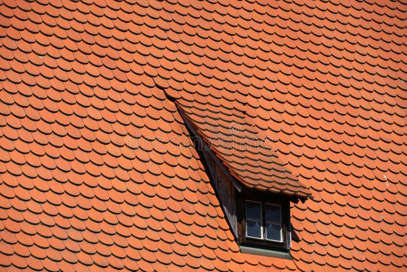 Beautiful Shot of a Red Roof with a Small Window Stock Image - Image of ...