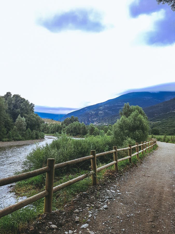 Beautiful Shot of a River with a Metal Fence on the Side Stock Image ...