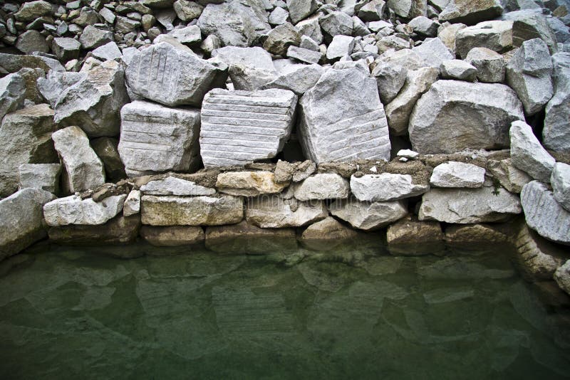 Beautiful Shot of Rock Slide by Green Water Stock Image - Image of ...