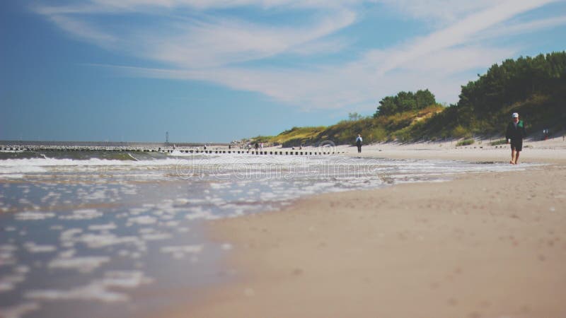 Beautiful Shot of a Sandy Beach and Walking People Stock Photo - Image ...