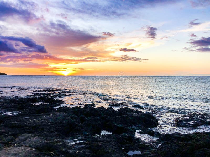 Beautiful Shot of Sea Waves Hitting the Rocks Under a Blue Cloudy Sky ...